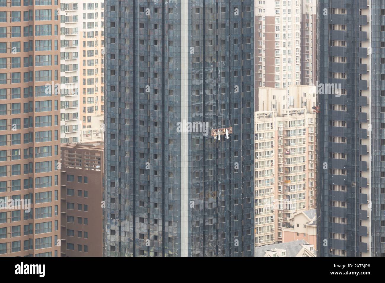 This aerial view captures a maintenance work platform suspended between ...