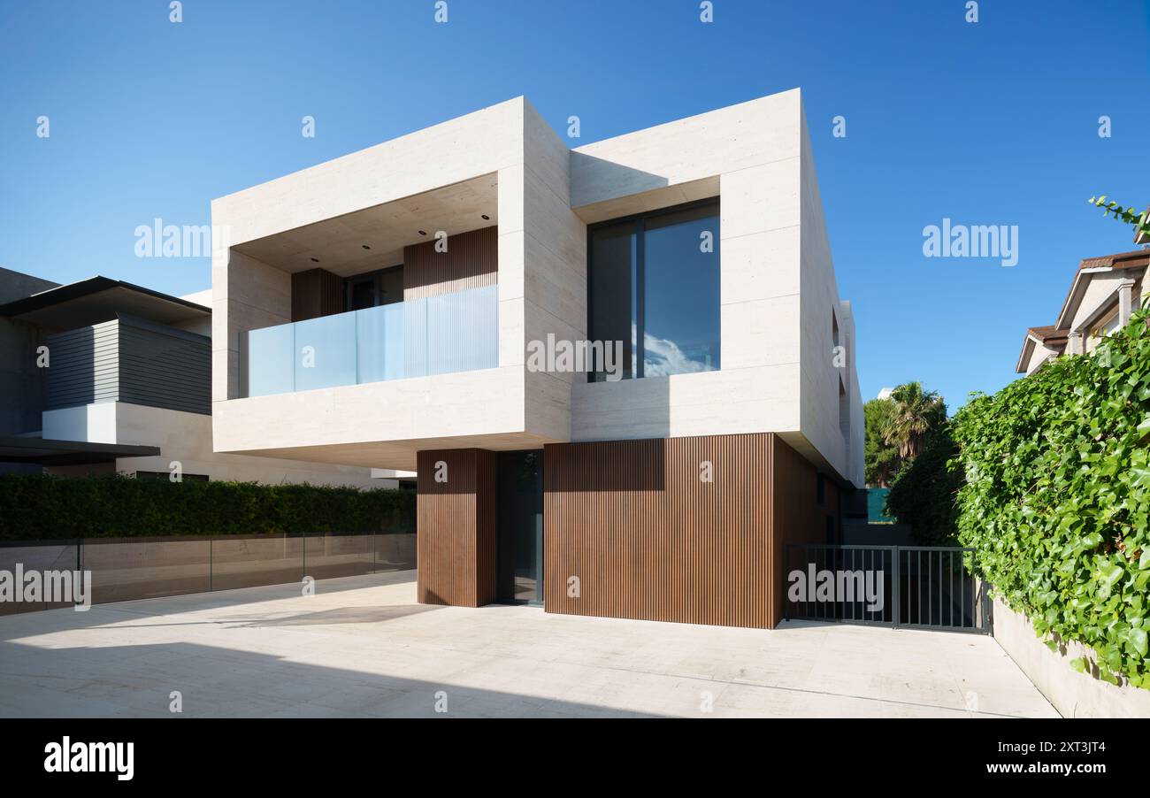 This image showcases a luxurious 21st-century house with a distinct ...