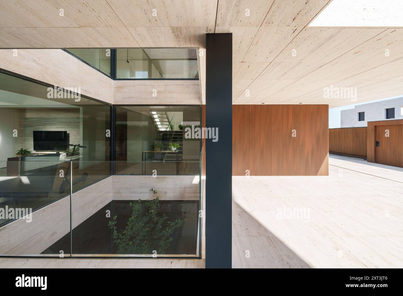 This image showcases a modern minimalist home featuring clean lines ...