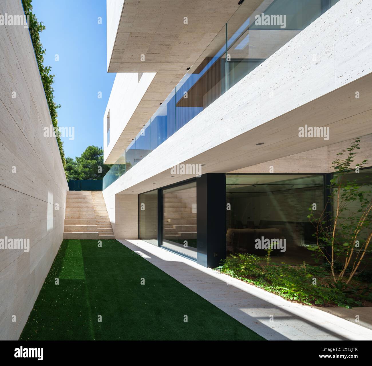 This image showcases the sleek exterior of a modern design house ...