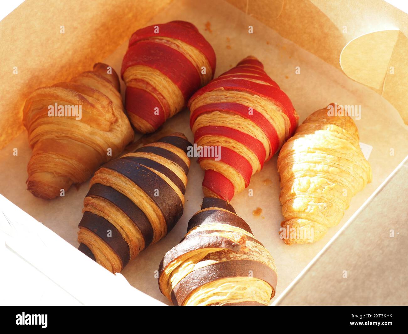 Fresh many different baked croissants in delivery box Stock Photo - Alamy
