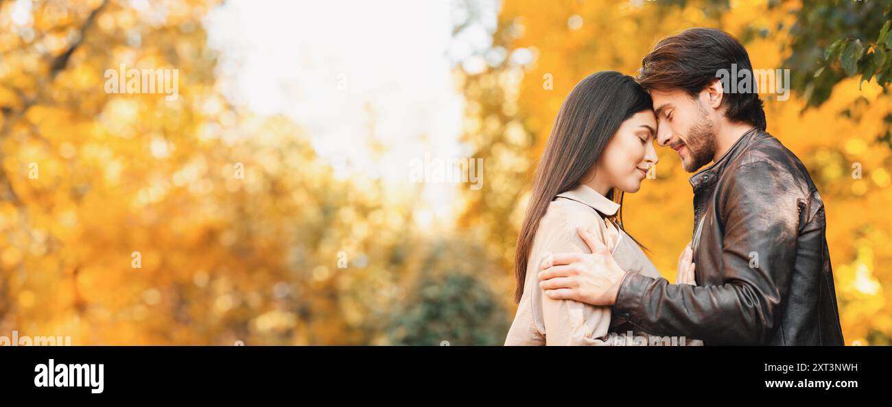 Romantic lovers embracing and touching each other with foreheads Stock ...