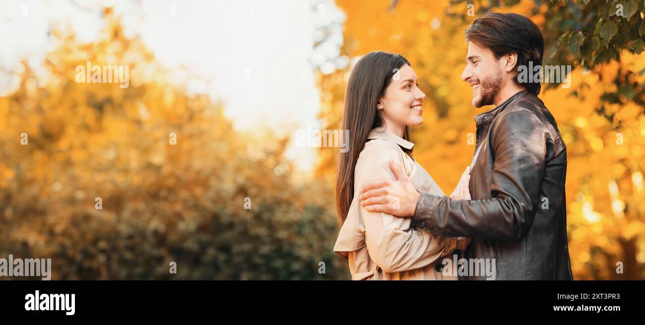 Positive couple embracing and joking, having date at park Stock Photo ...