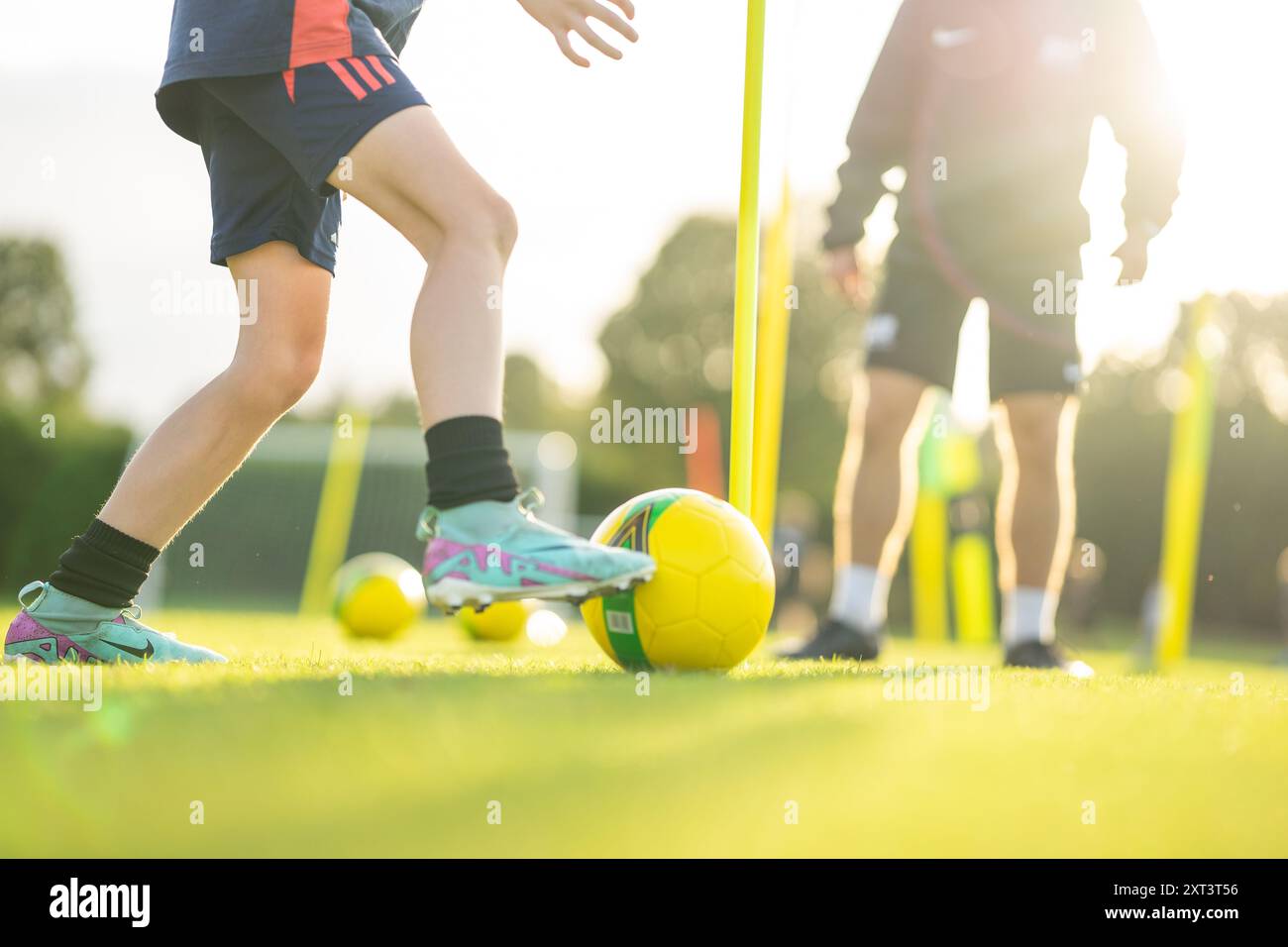 Football coach teaching outdoors Stock Photo - Alamy