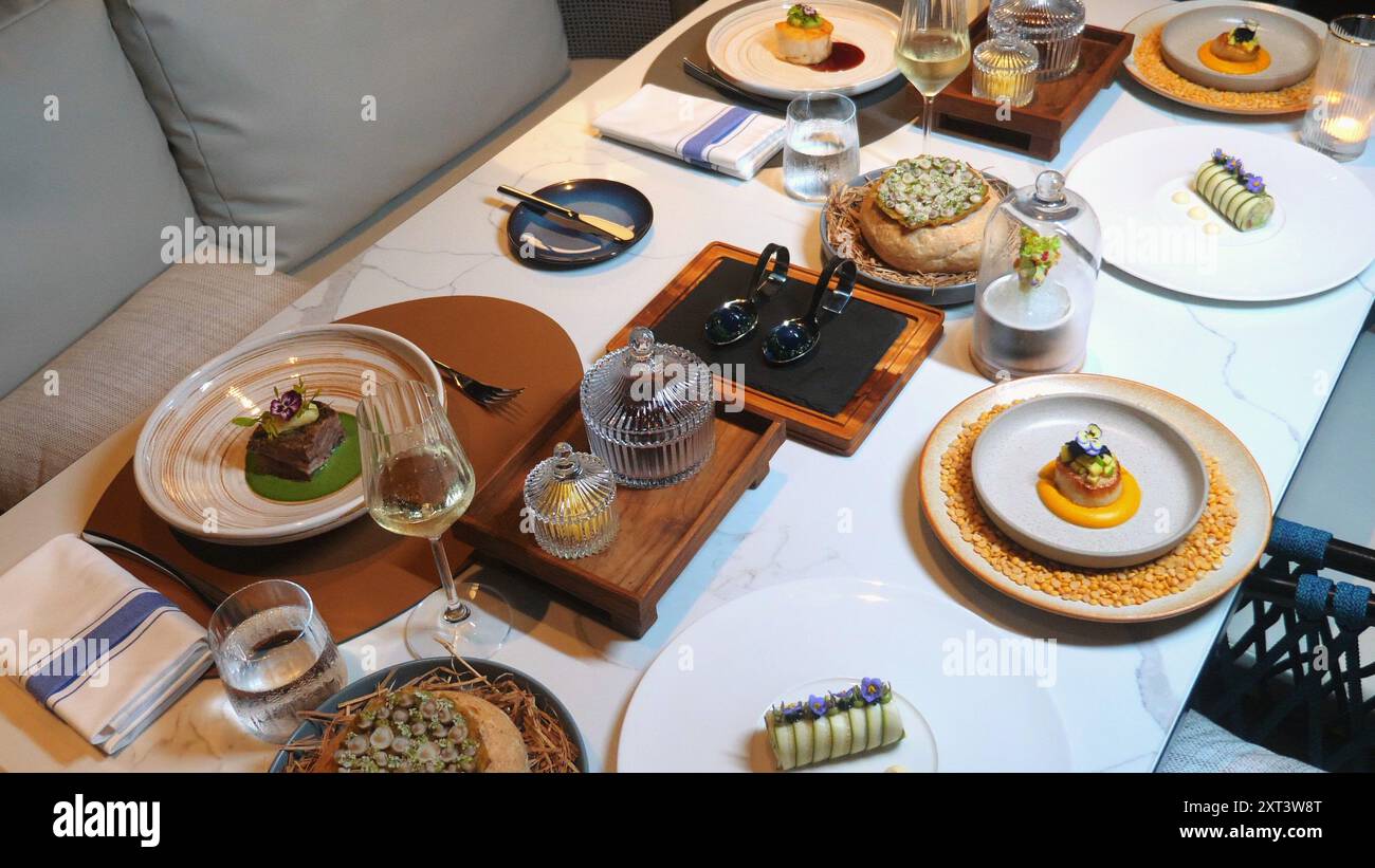 Elegant Dining Experience with Gourmet Dishes and Fine Wine on Stock ...