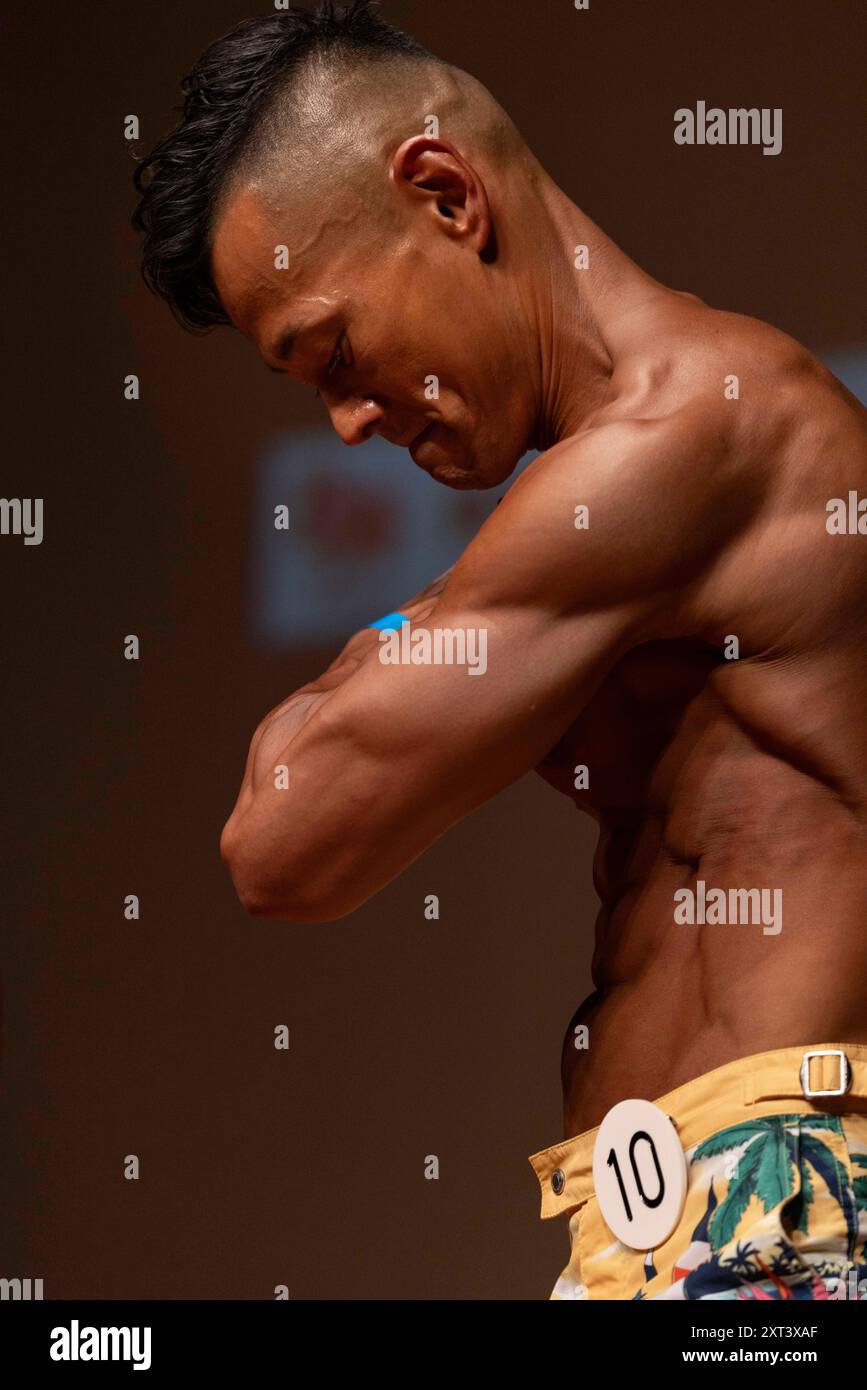 Yokoi Hideto poses during Men's Physique competition at ANNBBF's 1st ...