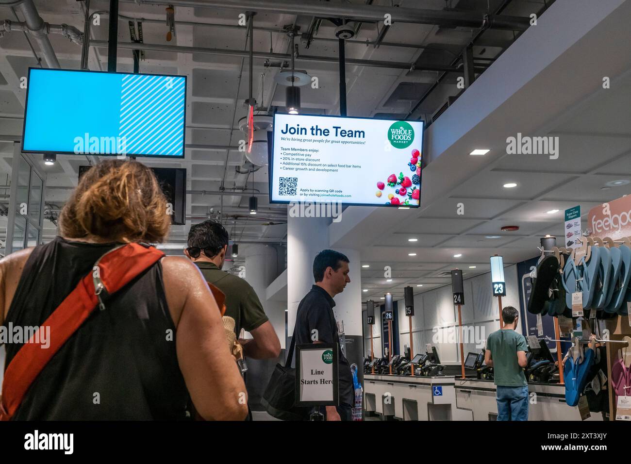 A digital sign at the check-out line in a Whole Foods Market in New ...