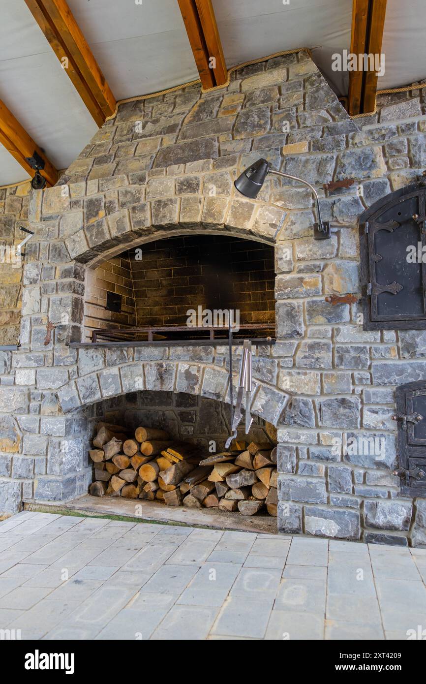 Stone barbecue firewood, open brick oven for cooking kebabs and other ...