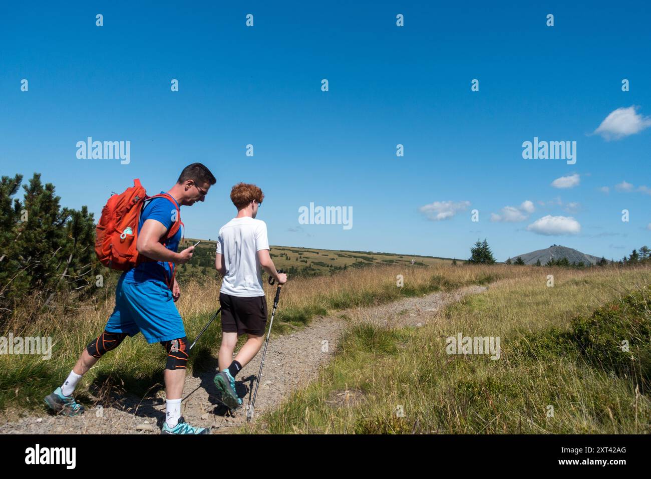 Two people walking through pathway hi-res stock photography and images ...