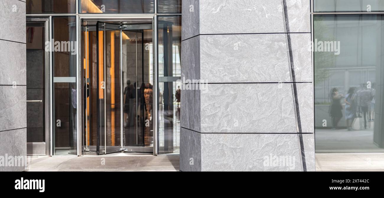 Concrete facade of an office building entrance. Empty space for logo or ...