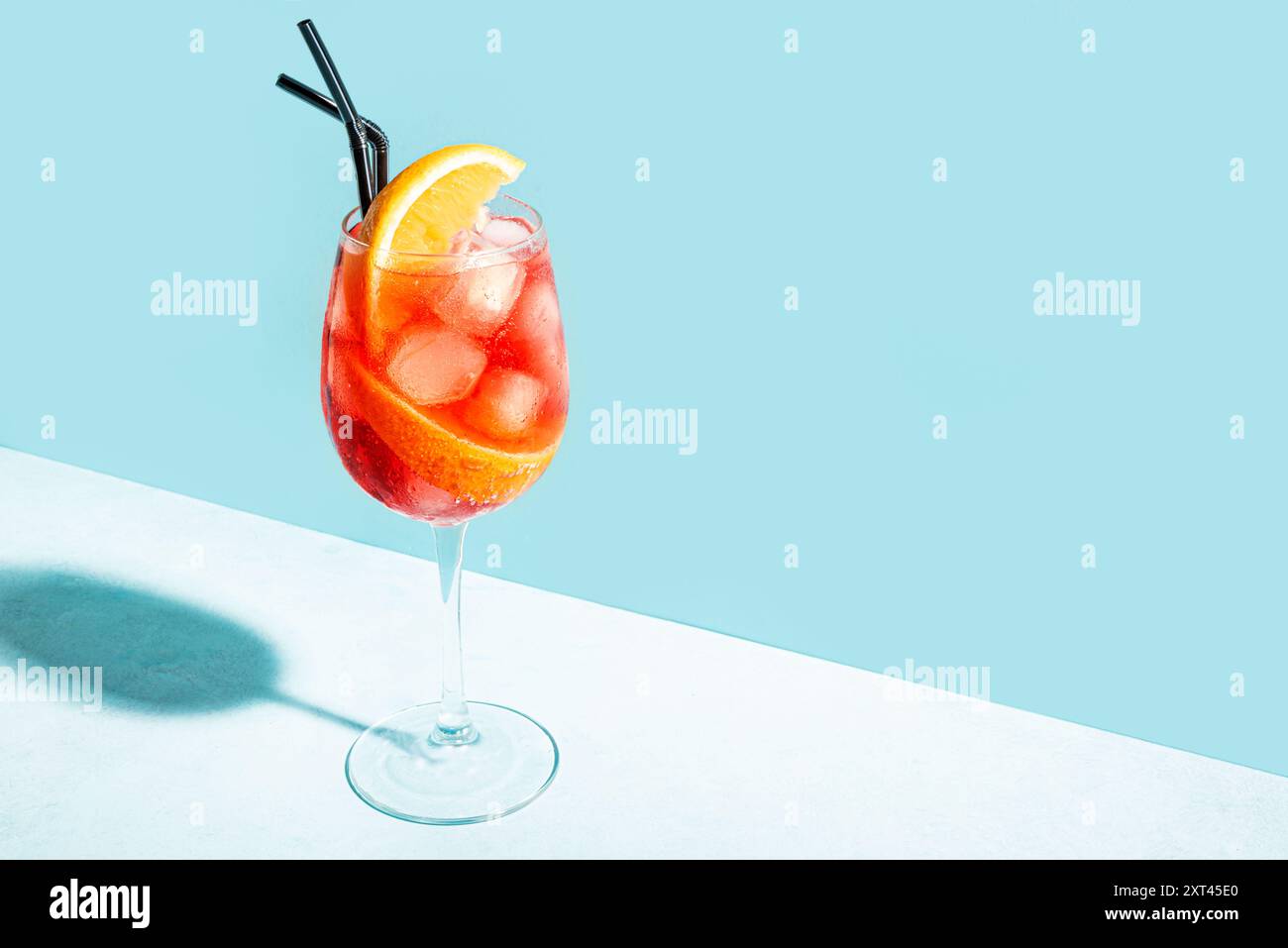 Aperol Spritz Cocktail in glass with orange slices on blue background ...