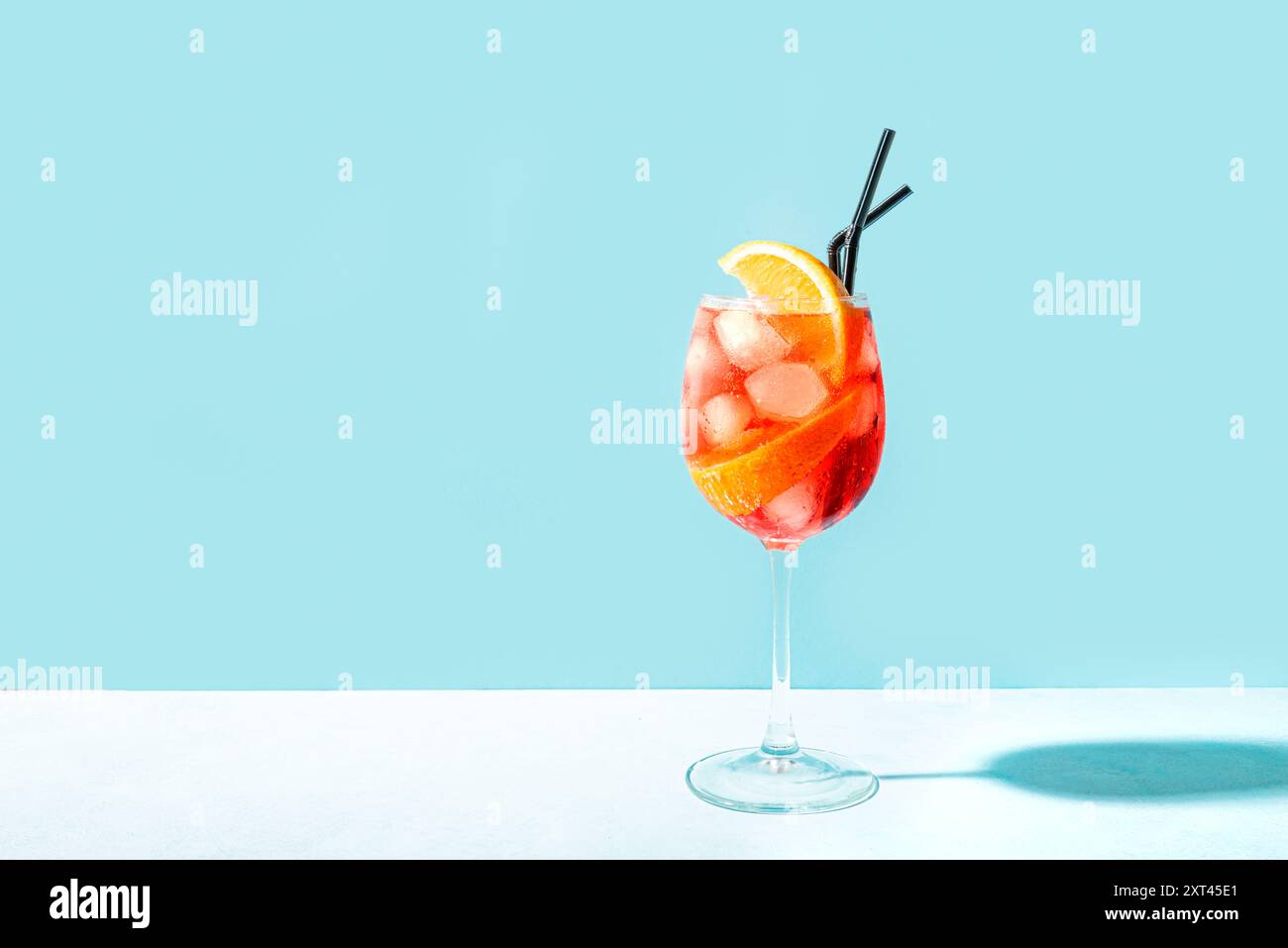 Aperol Spritz Cocktail in glass with orange slices on blue background ...
