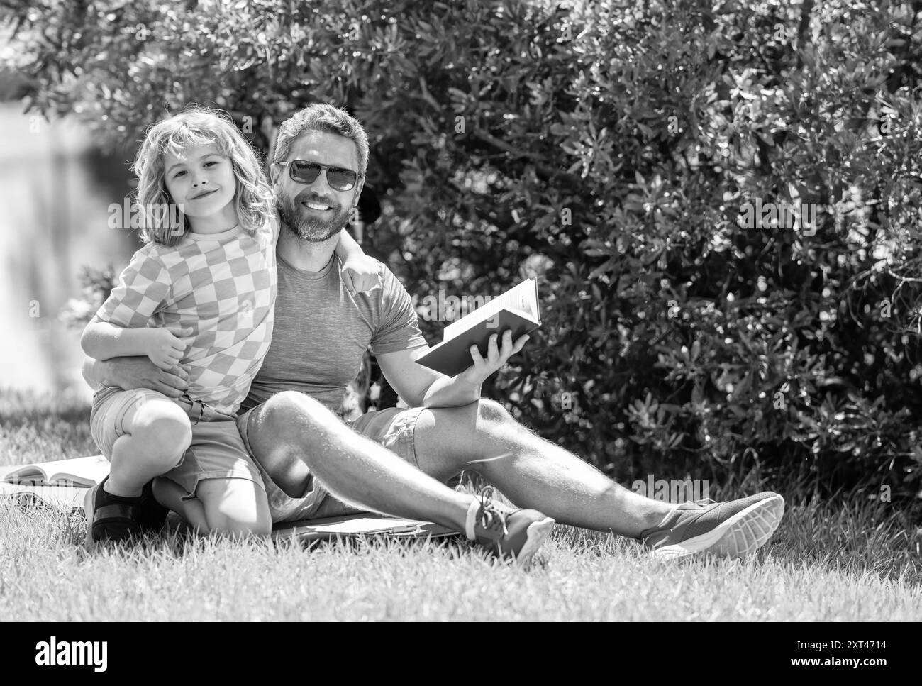 Father and son connect through stories in nature. Father and son ...