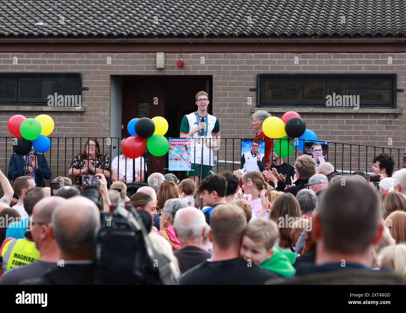 Gold and bronze medal winning swimmer Daniel Wiffen addresses the crowd ...