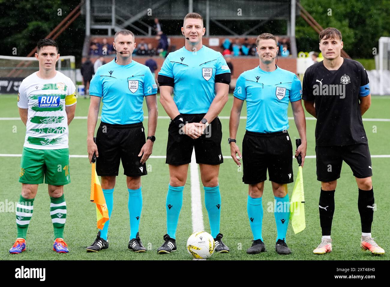 (Left to right) The New Saints' Danny Redmond, assistant referee Simon ...