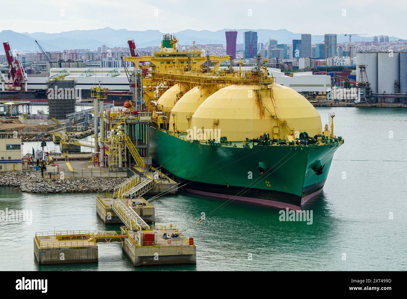 Large LNG tanker unloading at Barcelona port gas terminal, liquefied natural gas tanker ...