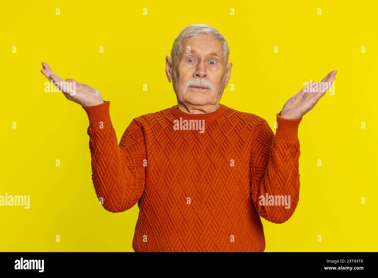 What. Why. Angry senior man raising hands in indignant expression ...