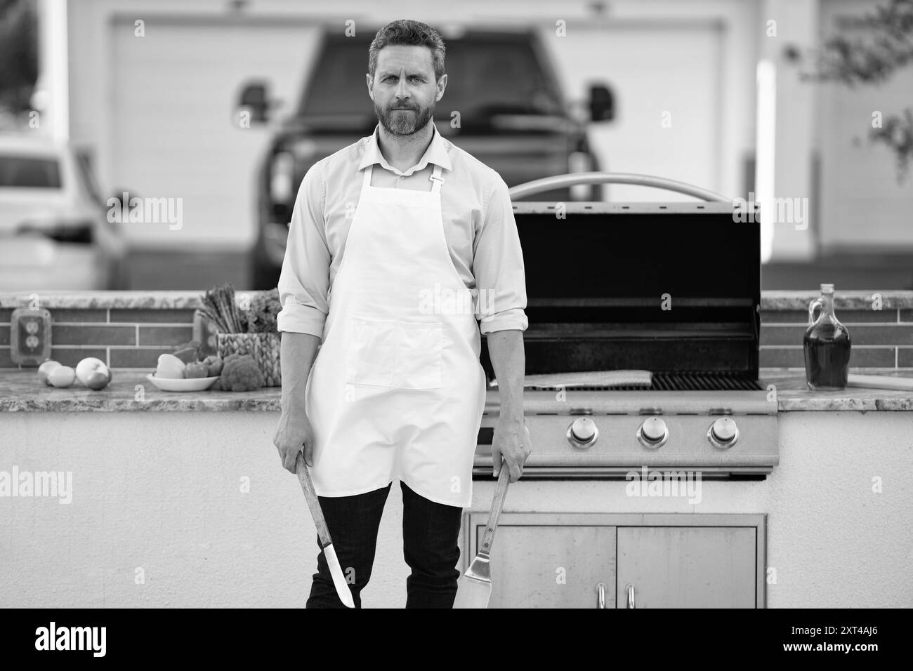 mature man grilling salmon fillet. man grilling salmon fillet outdoor ...