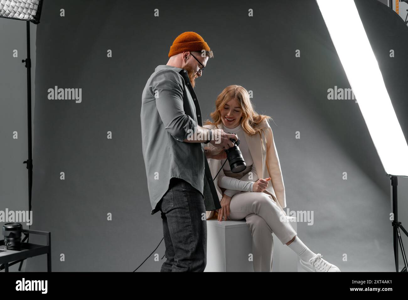 Photographer and model collaborating in a studio photoshoot, reviewing ...