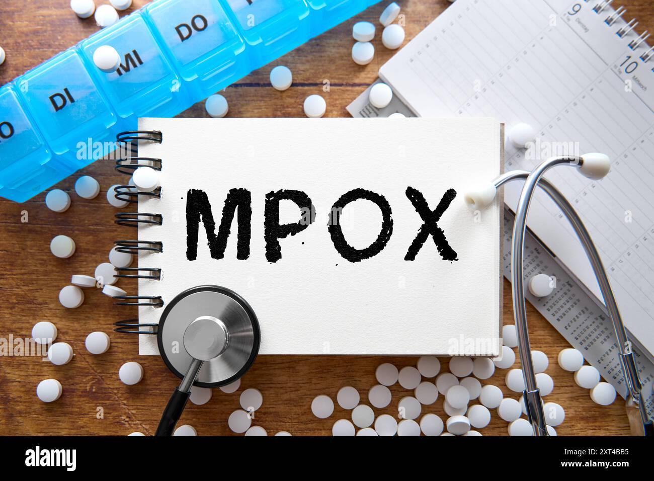 13 August 2024: Diagnosis: Mpox, surrounded by tablets and medical ...