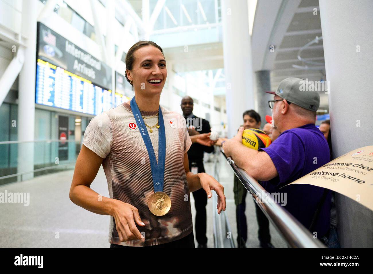 Toronto, Canada. 12th Aug, 2024. Olympic medalist Kylie Masse signs ...