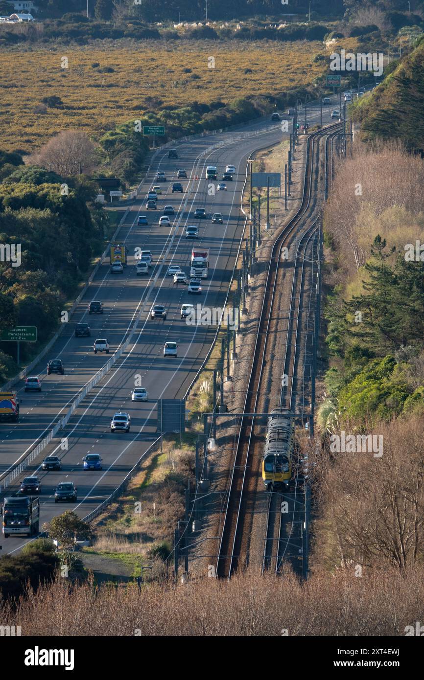 Highway traffic and suburban railway train in Kapiti, New Zealand Stock ...