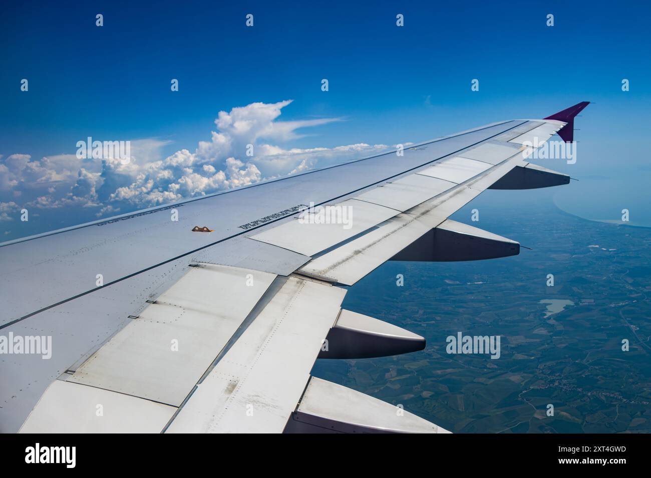 Airplane wing photographed from the plane's window Stock Photo - Alamy