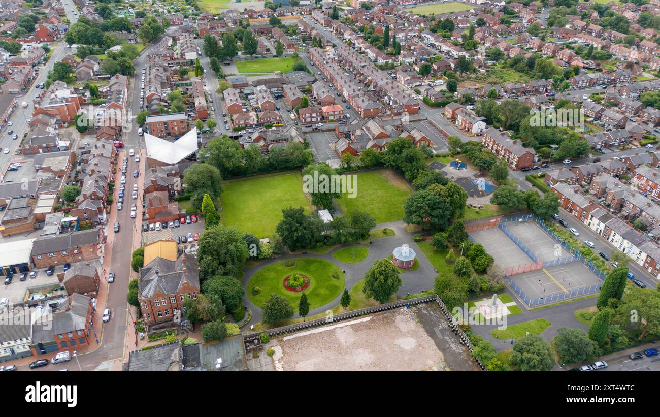 Aerial, Denton, Tameside, Victoria park and the terraced housing around ...