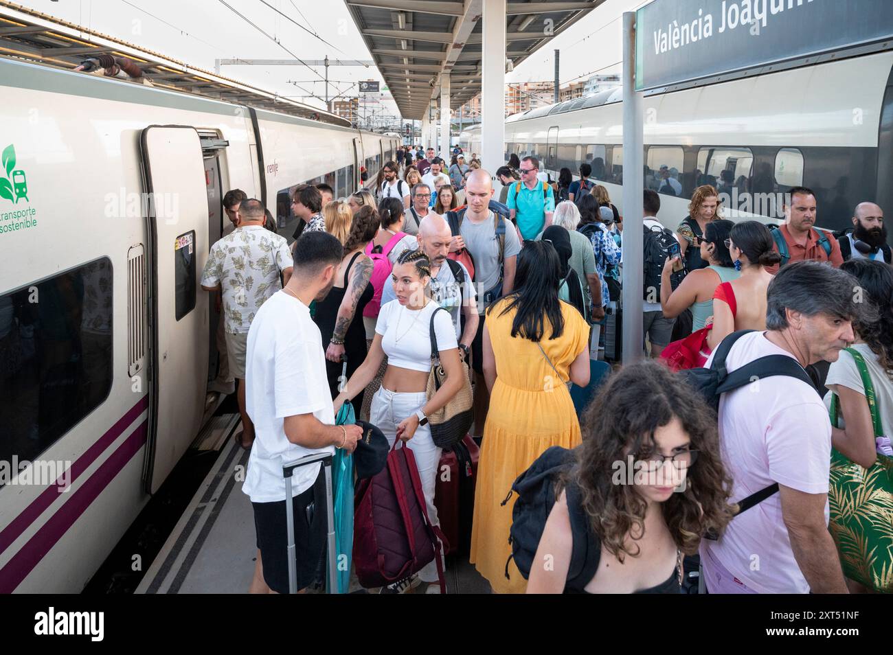 Passengers seen waiting to board a train operated by Spain's national ...