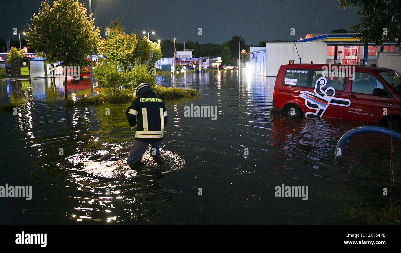 Aurich, Germany. 13th Aug, 2024. Heavy rain flooded a petrol station ...