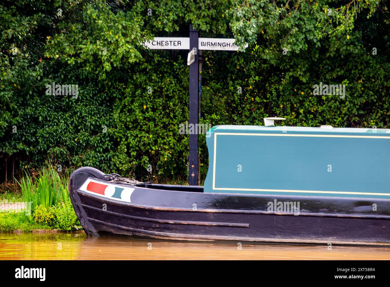 Canal narrowboat on the Shropshire union canal passing a sign for ...