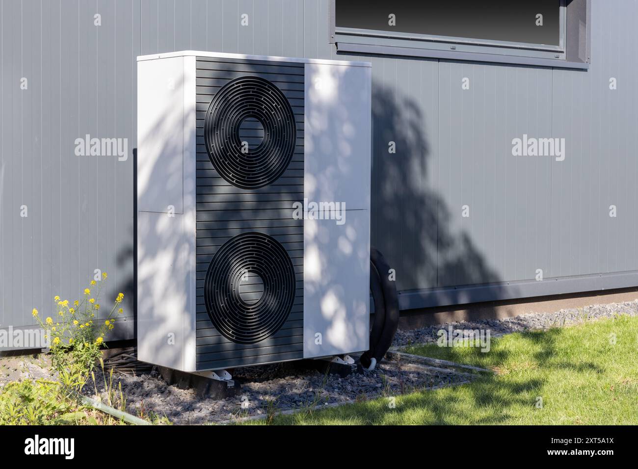 Heat pump unit installed outside a modern building Stock Photo - Alamy