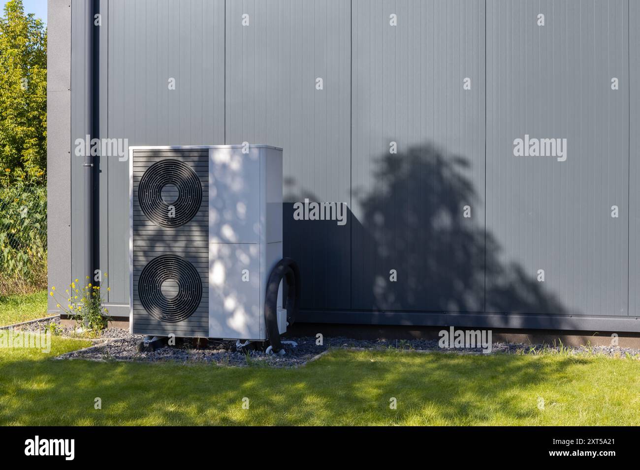 Modern Heat Pump Against Industrial Building Exterior Stock Photo - Alamy