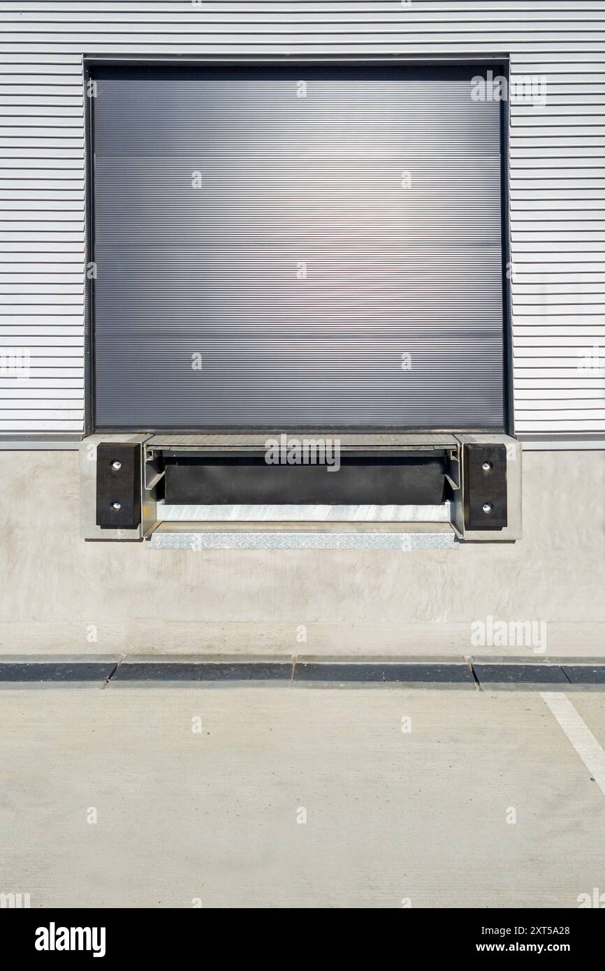 Industrial Loading Dock with Closed Roller Shutter Door Stock Photo - Alamy