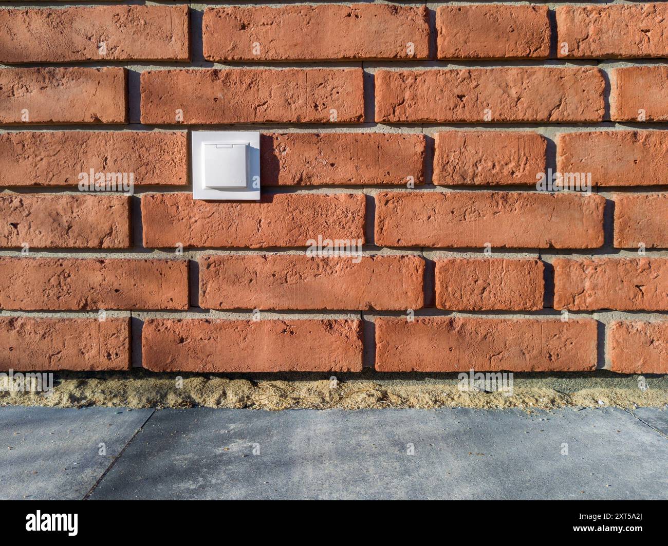 Outdoor Electrical Socket on Red Brick Wall Stock Photo - Alamy