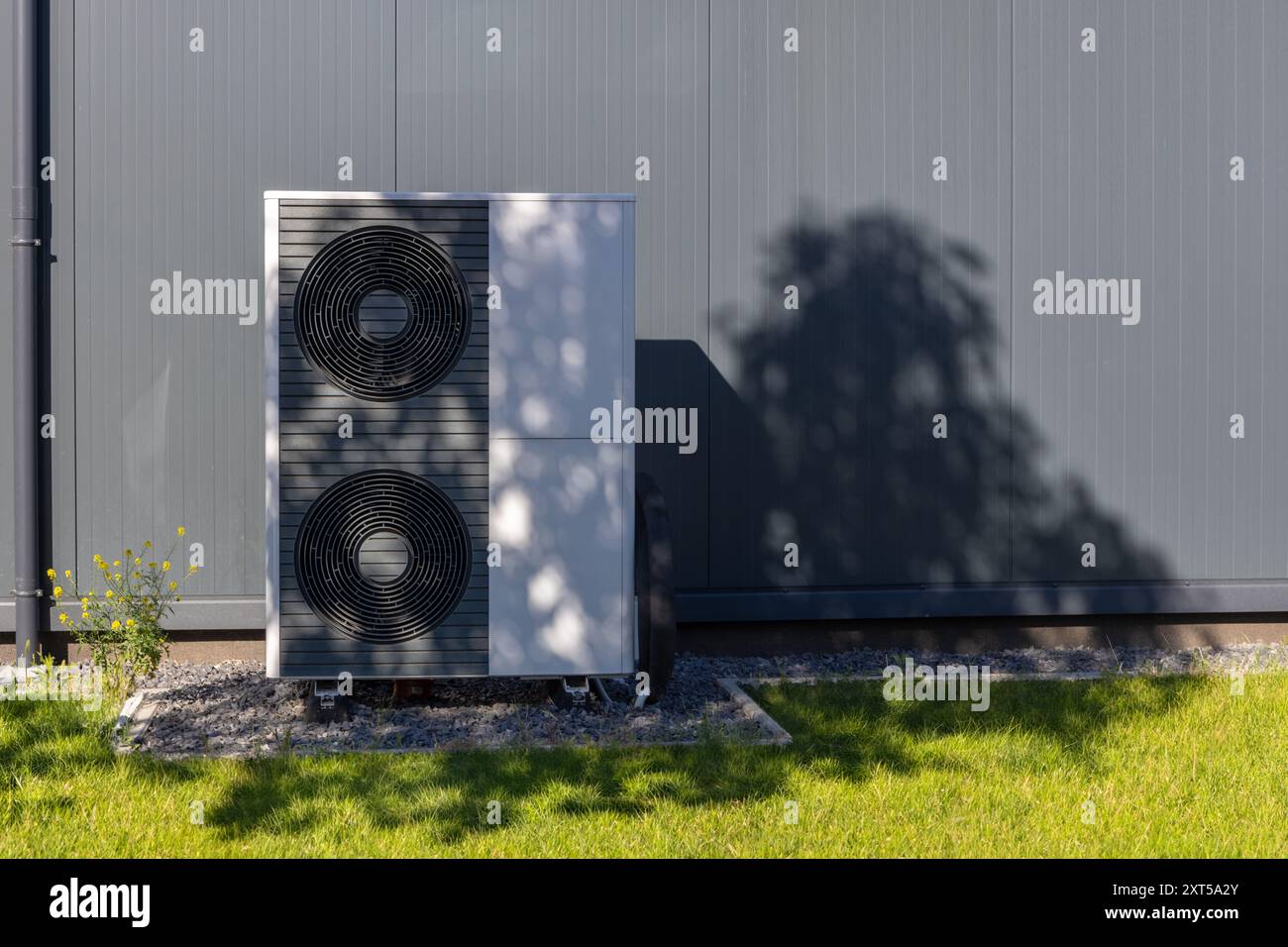 Modern Heat Pump Unit Against Gray Building Exterior Stock Photo - Alamy