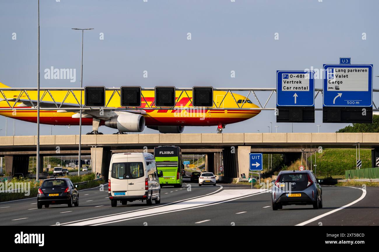 Amsterdam Schiphol Airport, DHL Cargo aircraft on the taxiway, bridge ...