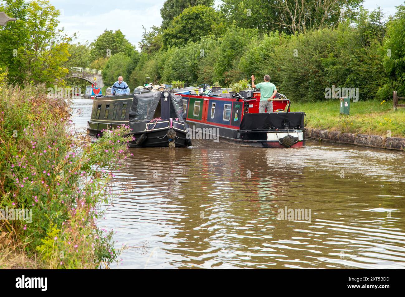 Narrowboat passing on the Shropshire union canal at Barbridge Cheshire ...