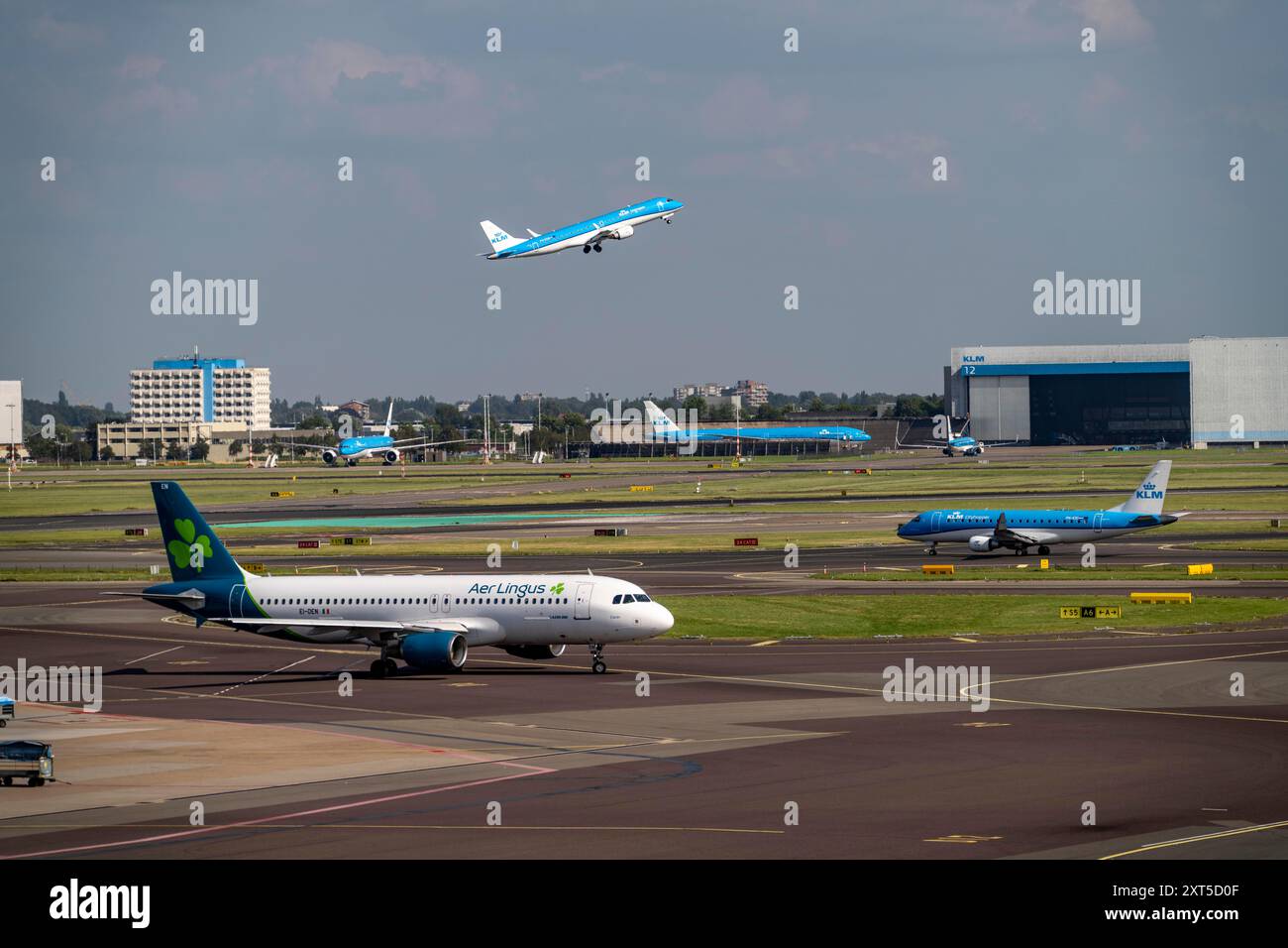 Amsterdam Schiphol Airport, airplanes on the taxiway, KLM plane takes ...