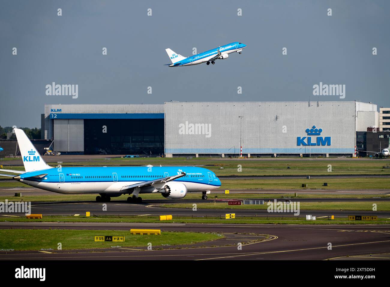 Amsterdam Schiphol Airport, airplanes on the taxiway, KLM plane takes ...
