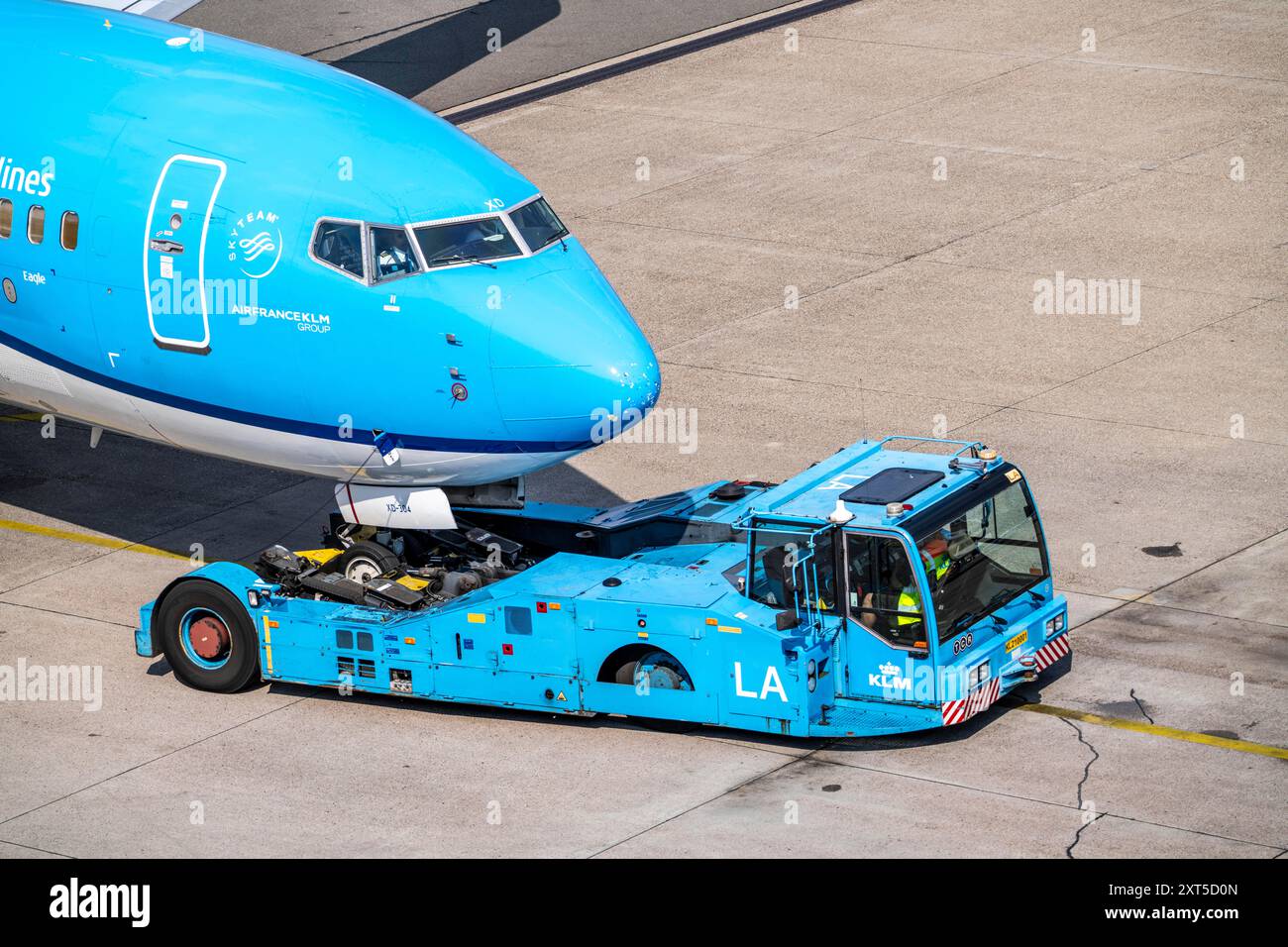 Boeing 737-800 of KLM, being driven from the terminal onto the apron ...