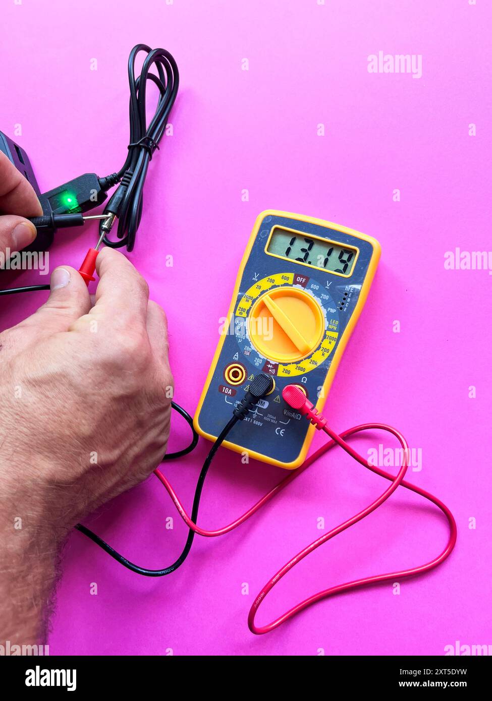 checking the voltage of the adapter with a multimeter Stock Photo - Alamy