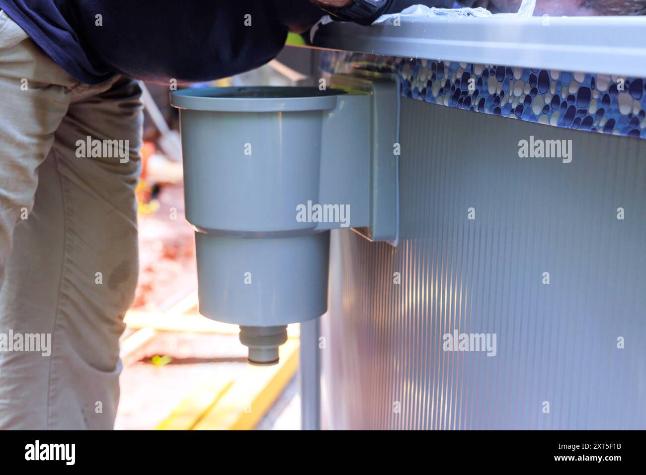 Cleaning of pool surface from dirt, trash debris with pool skimmer ...