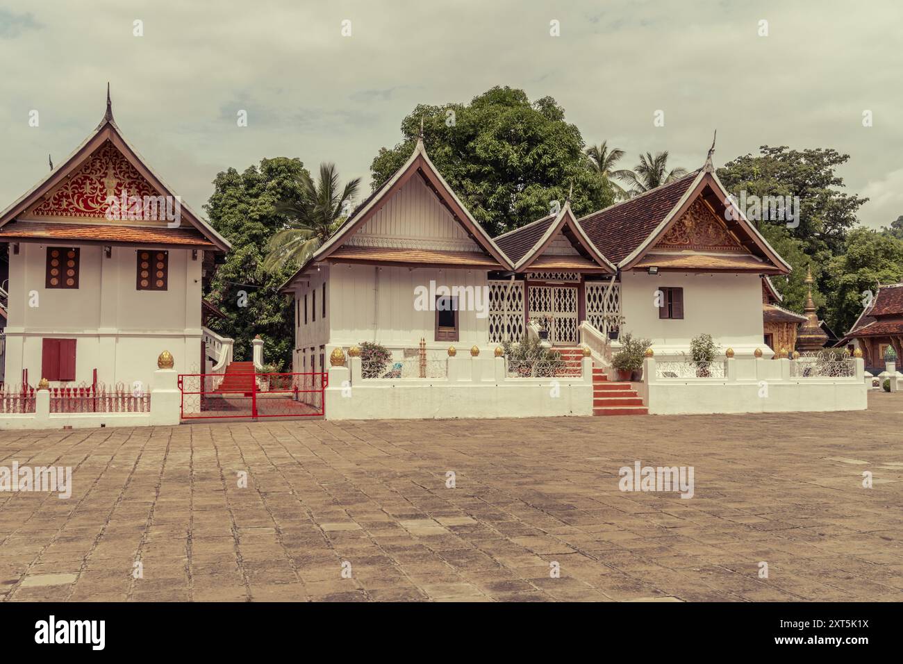 Buildings in Buddhist temple Wat Xieng Thong in Luang Prabang peninsula ...