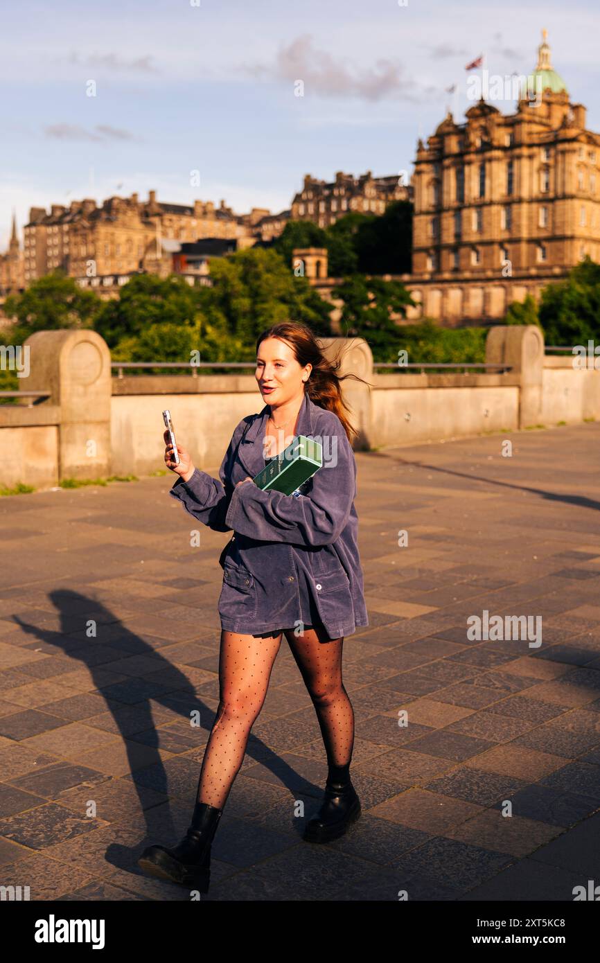 Tourists in Edinburgh taking in views, posing for photos, takin in the ...