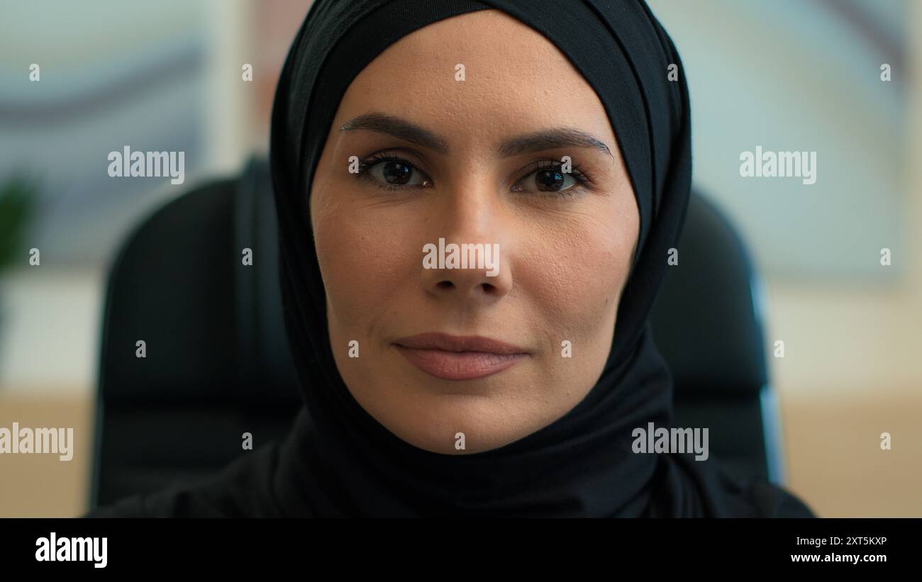 Close up face serious calm Arabian ethnic woman muslim islamic girl ...