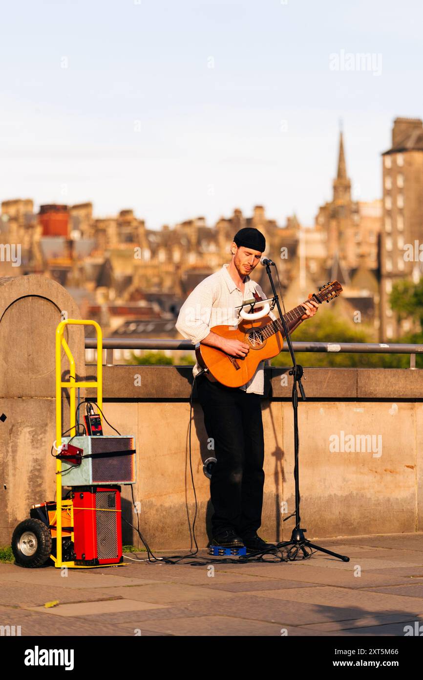 Tourists in Edinburgh taking in views, posing for photos, takin in the ...