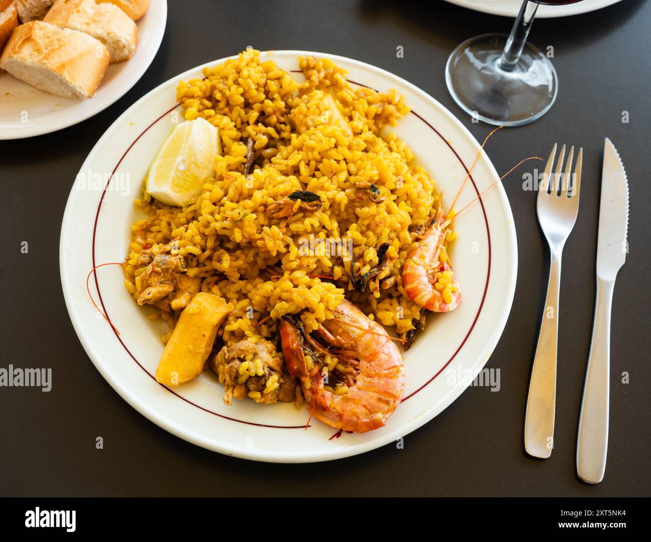 Traditional paella de mariscos with shrimps, calamaries and mussels ...
