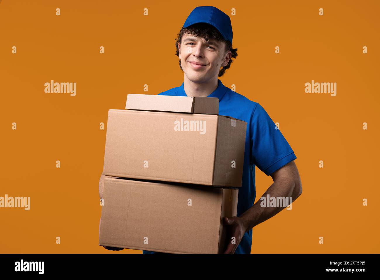Positive postal courier man with parcel box. Happy postman delivers ...