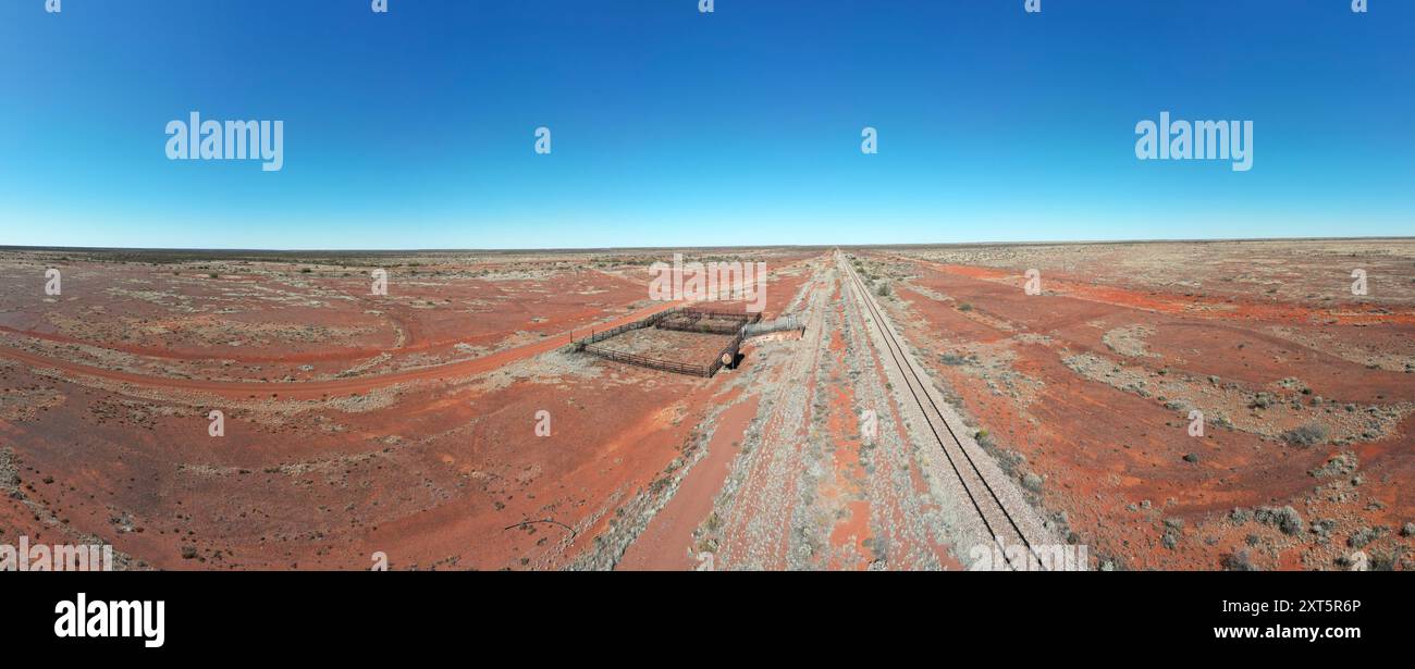 Holding yard for livestock in grazing country beside a railway line ...